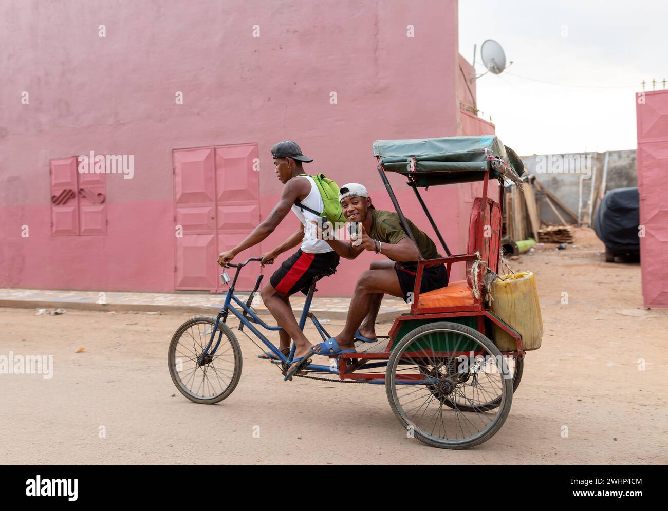 Traditional rickshaw on the city streets. Rickshaws are a common mode ...