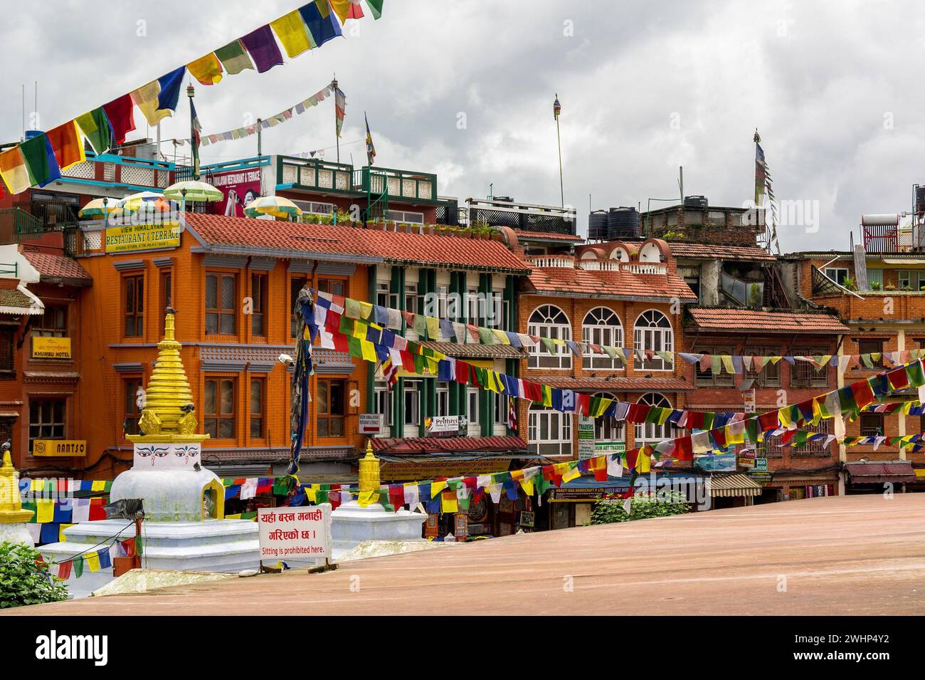 BOUDHA, NEPAL - JULY 28, 2013: Buildings next to Boudhanath Stupa in ...