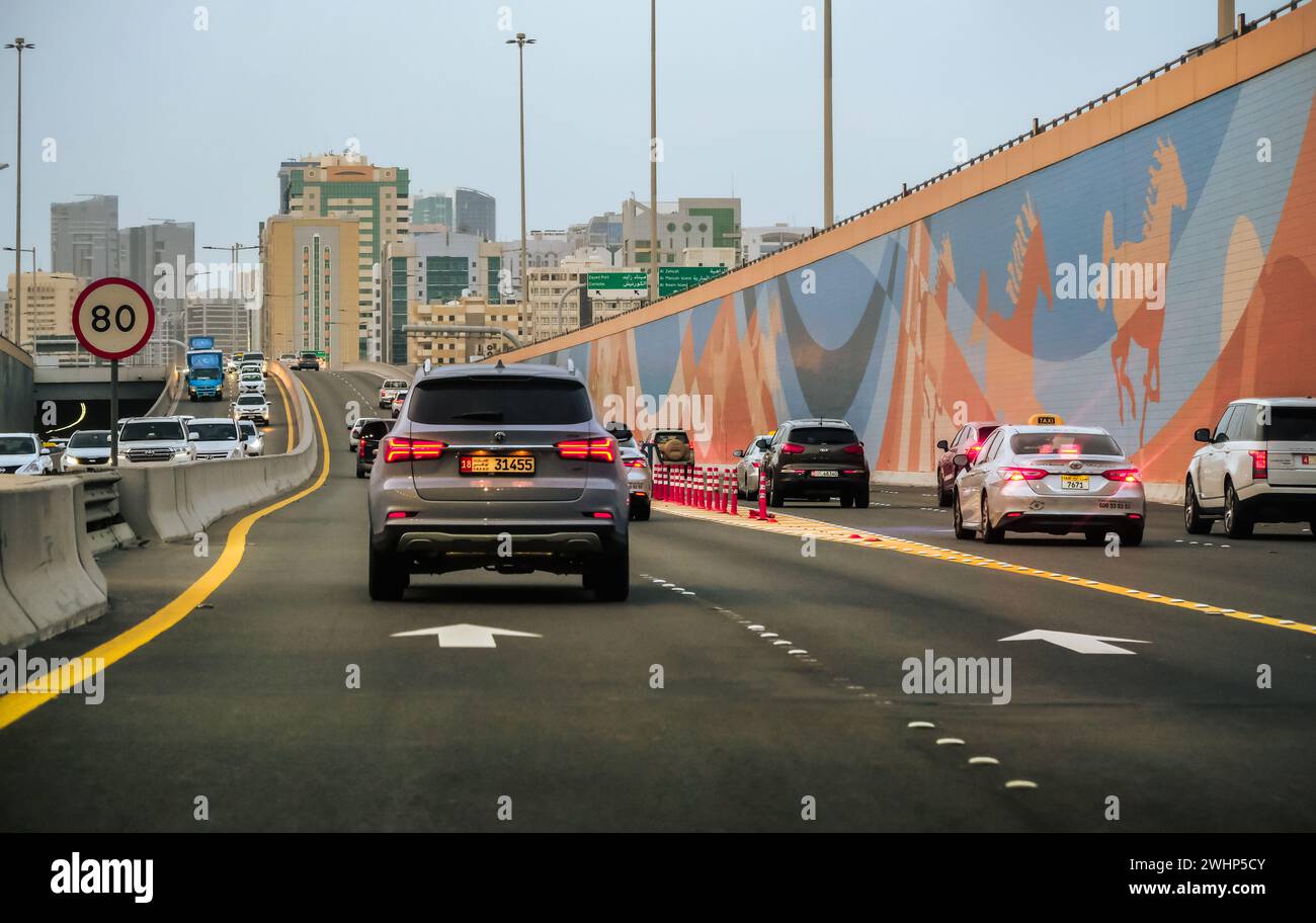 Car traffic on a highway road with skyscrapers building in the ...