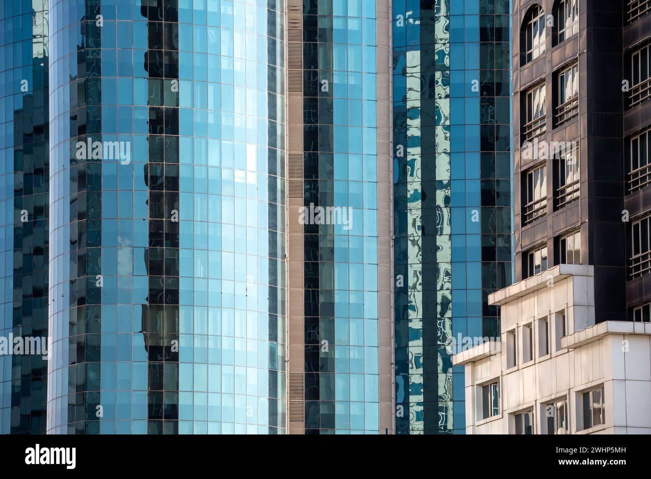 Many windows and walls facade of a modern skyscraper without people ...
