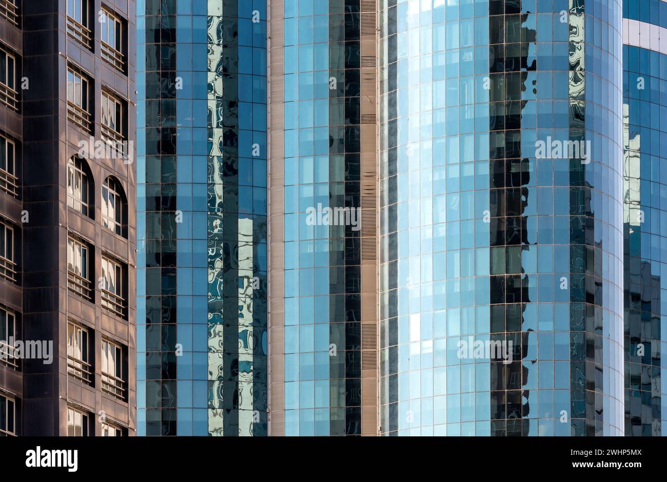 Many windows and walls facade of a modern skyscraper without people ...