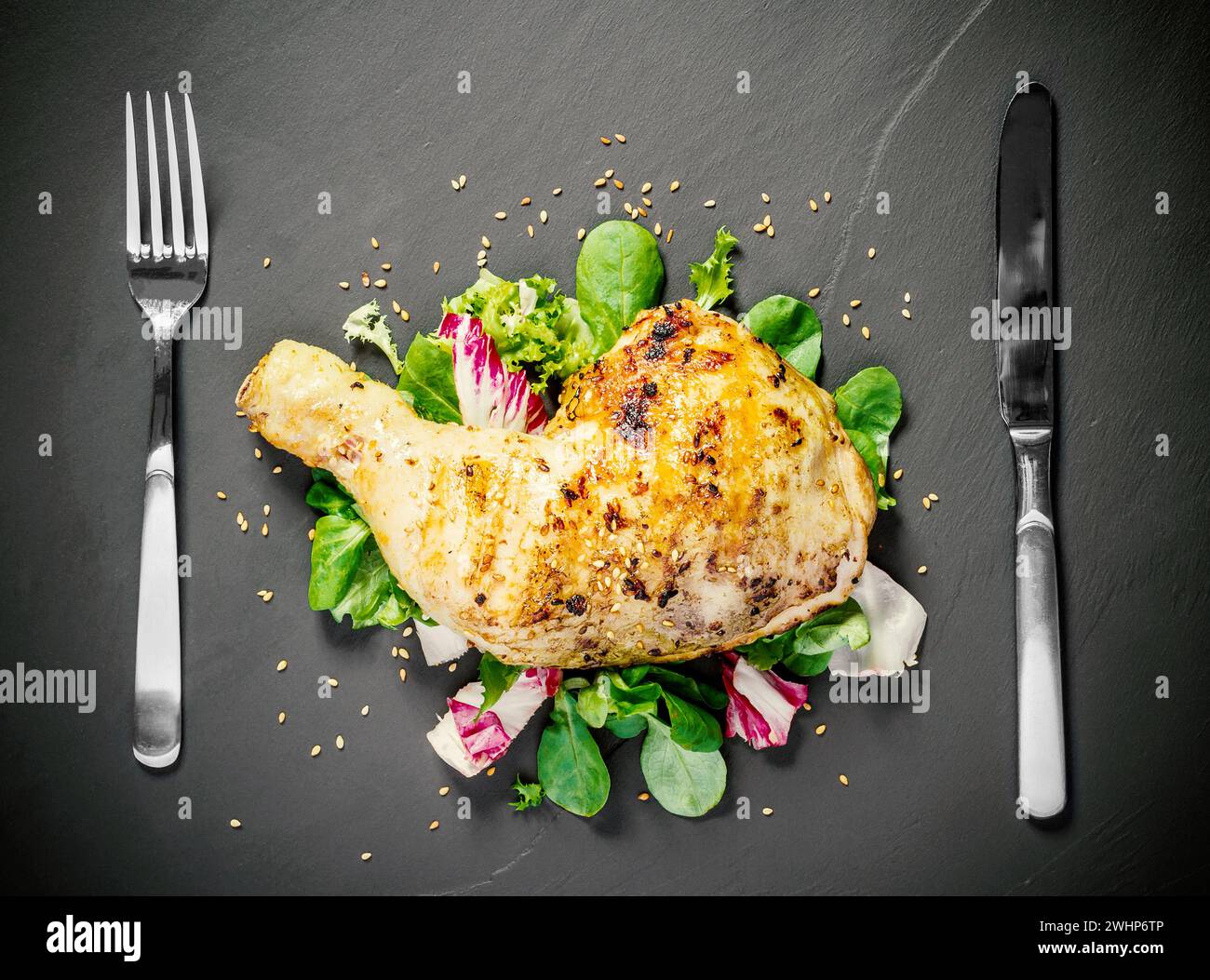 Plate of roast chicken with corn, salad and red wine Stock Photo - Alamy