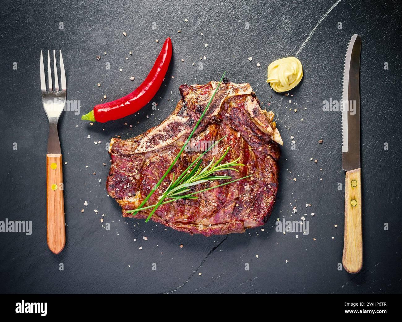 Grilled club steak on slate plate Stock Photo - Alamy