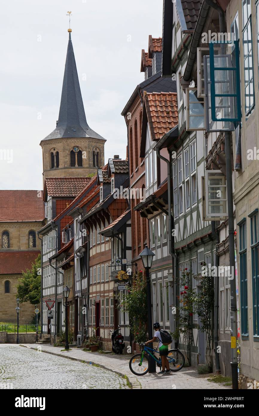 Facades of half-timbered houses with the church tower of St. Godehard ...