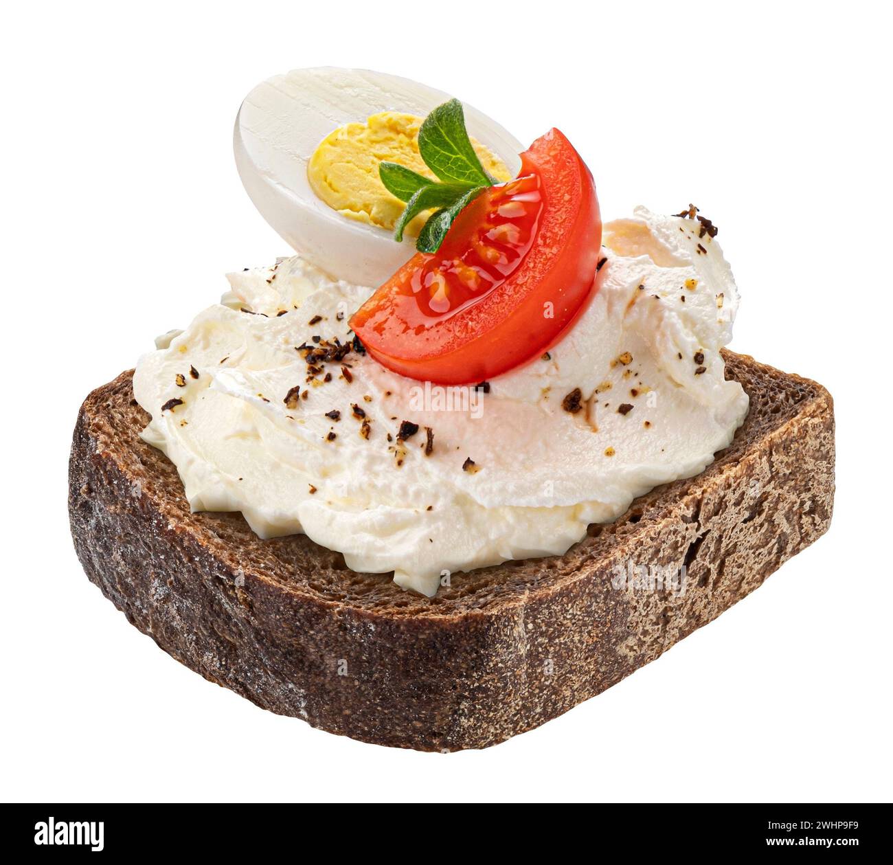 Slice of rye bread with cream cheese, tomato and egg isolated on white ...