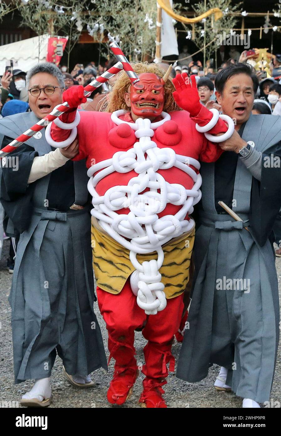 Aka-oni, a red demon walks zigzag on the shrine path like thunder ...