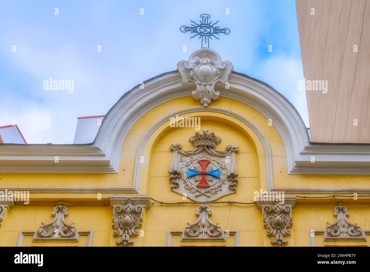 Capital structure with a coat of arms and a Christian cross ...