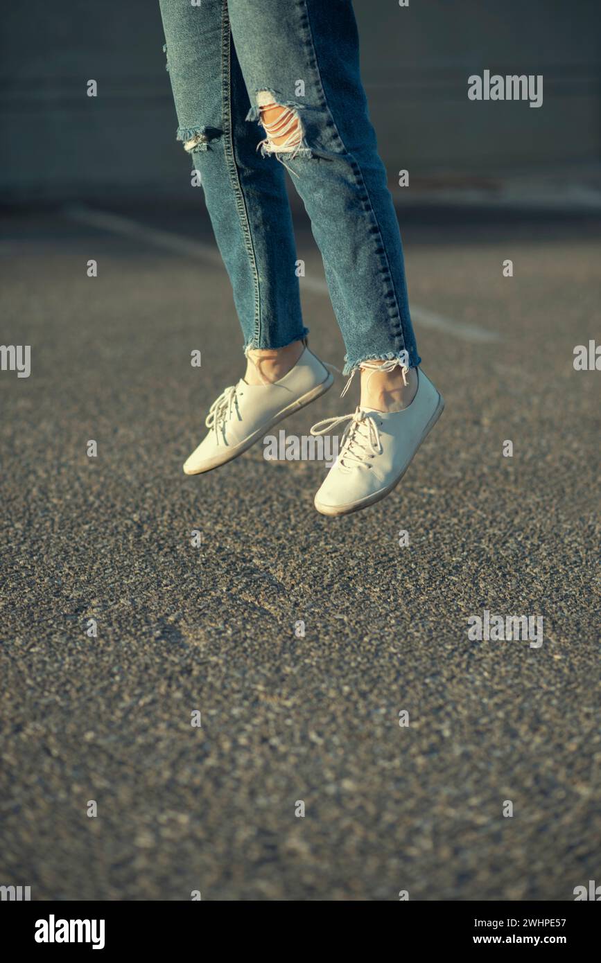 Close up of woman's legs jumping Stock Photo - Alamy
