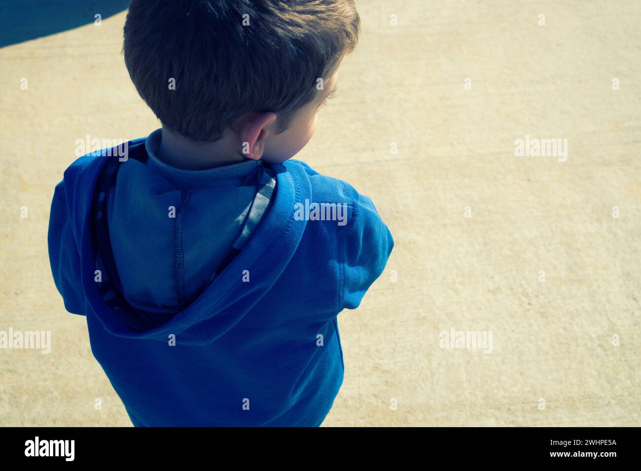 High angle rear view of little boy standing outdoors Stock Photo - Alamy