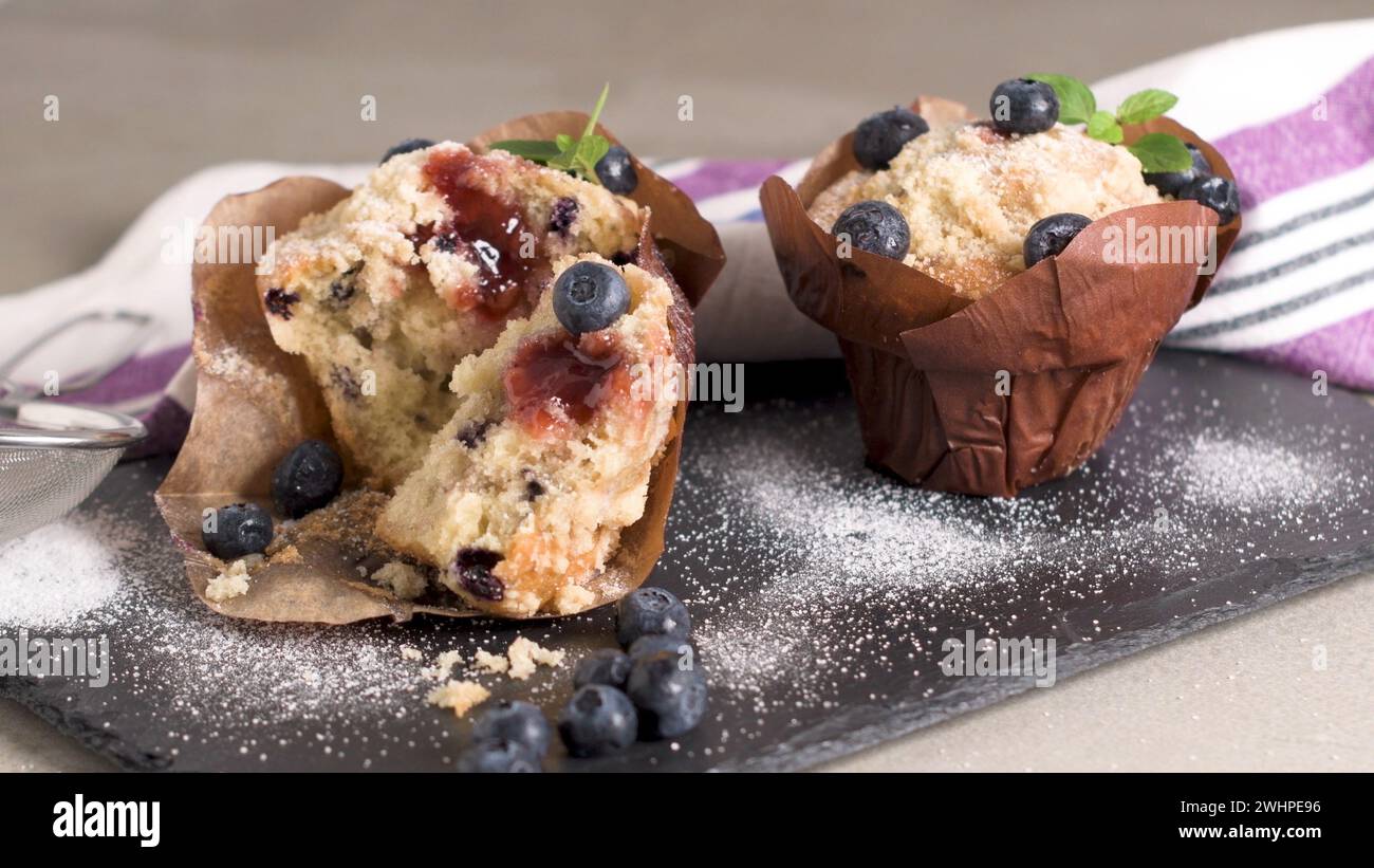 Muffins with red fruits jam fill Stock Photo - Alamy