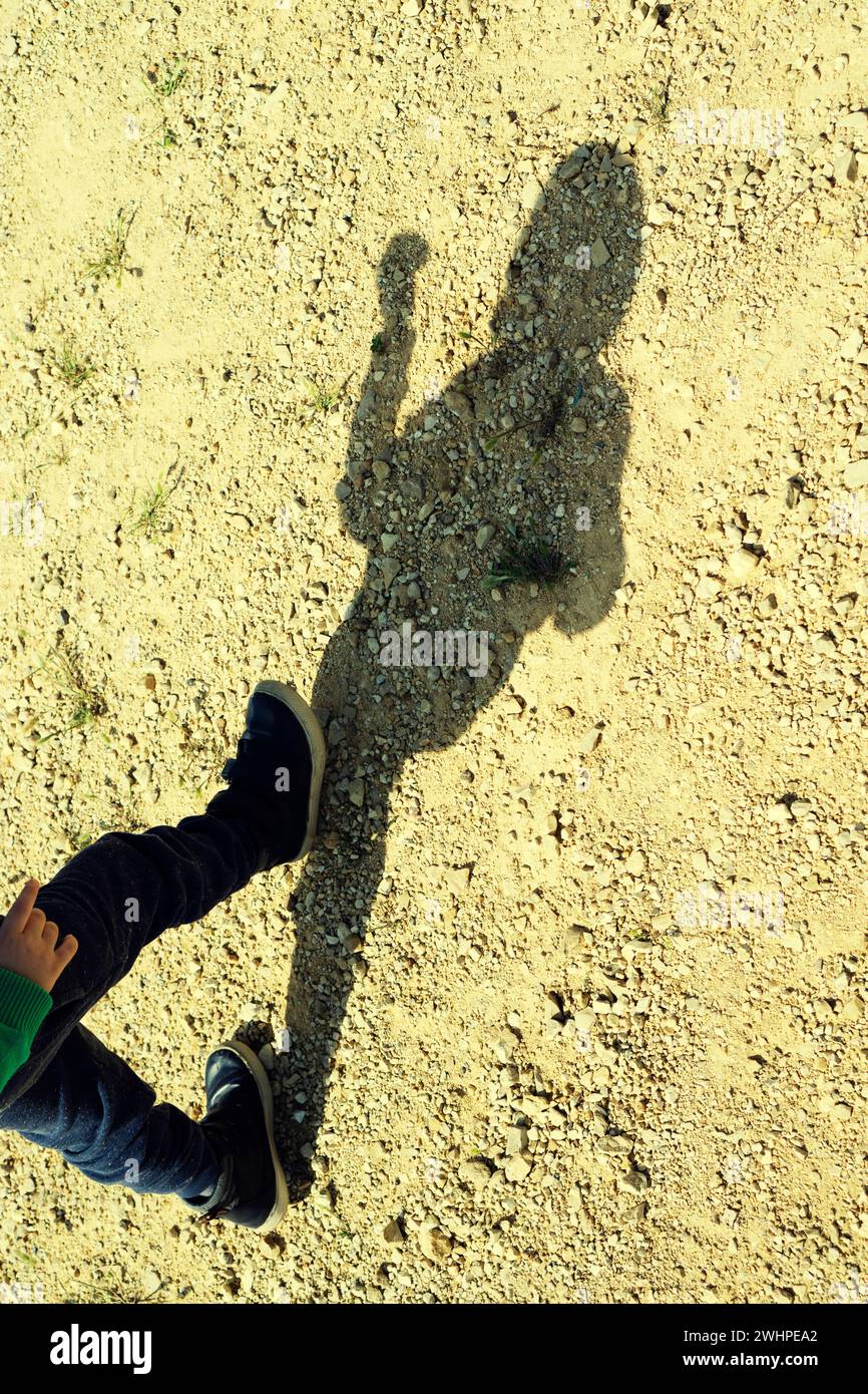 Boy walking outdoors hi-res stock photography and images - Alamy