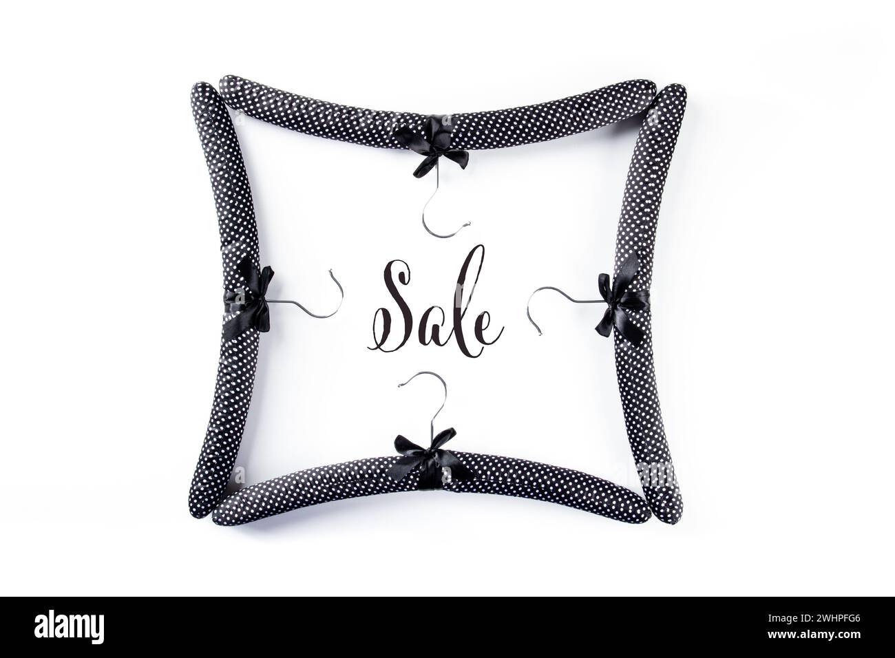 A frame of satin padded hangers with the word Sale, a banner design ...