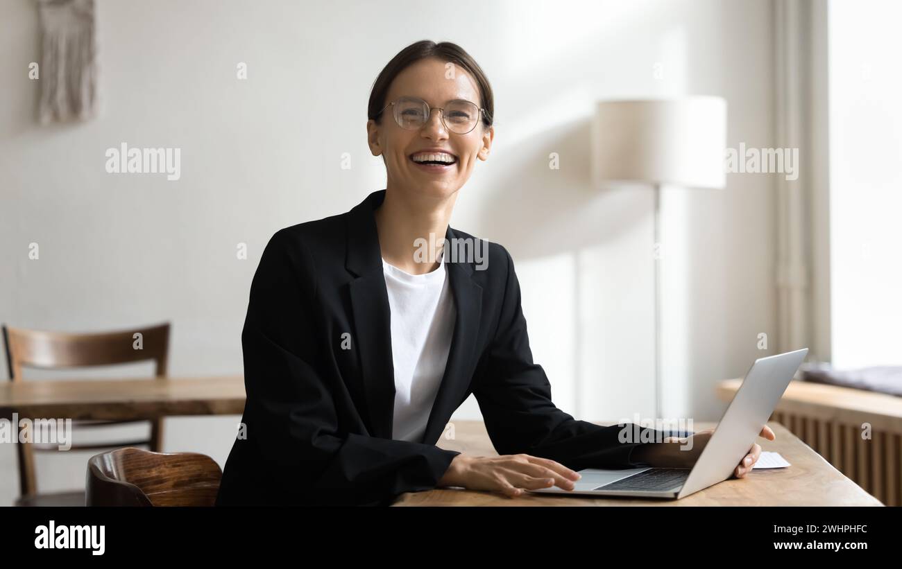 Happy young professional woman workplace head shot portrait Stock Photo ...