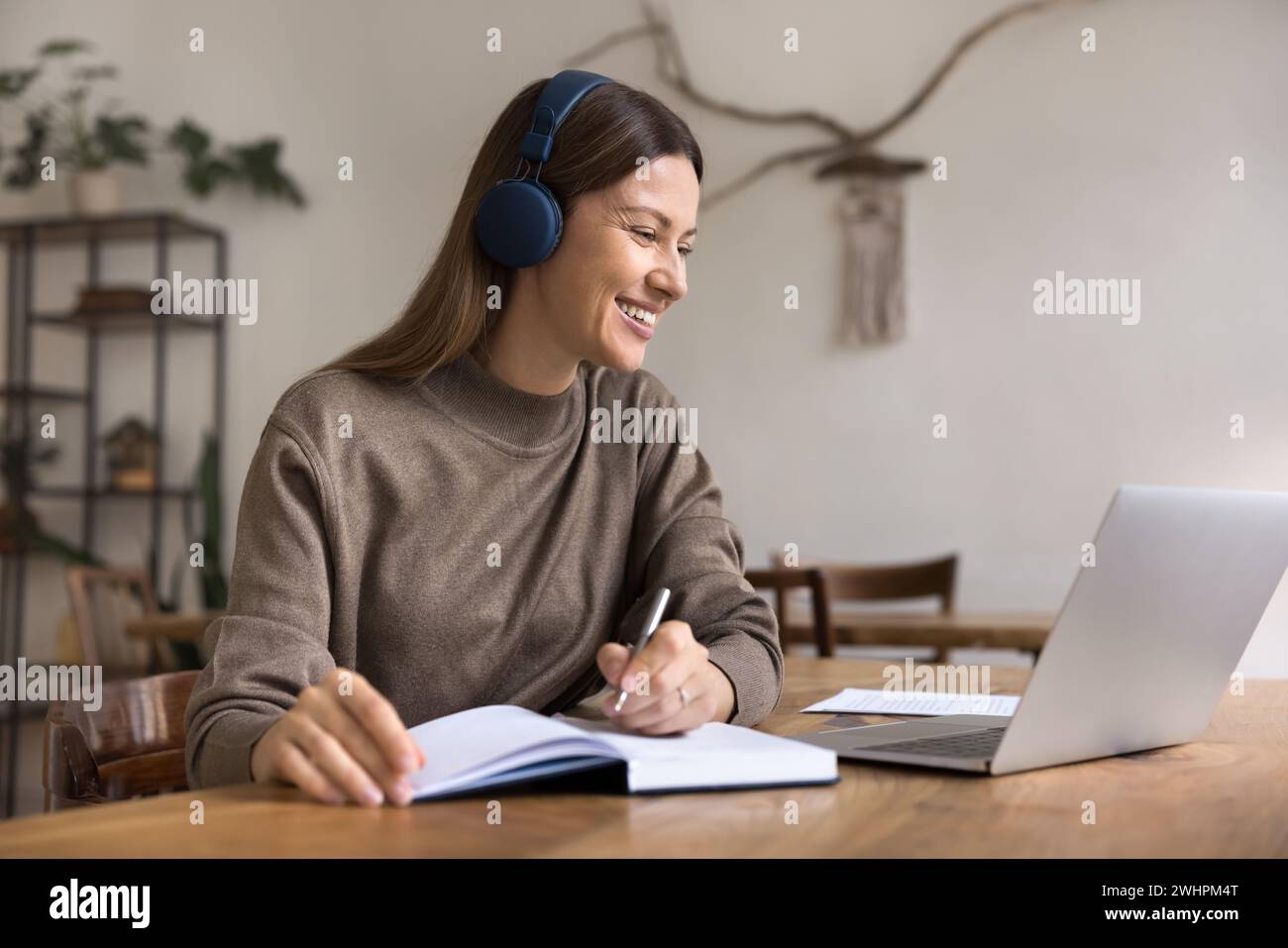 Happy adult student woman studying on Internet, using laptop Stock ...