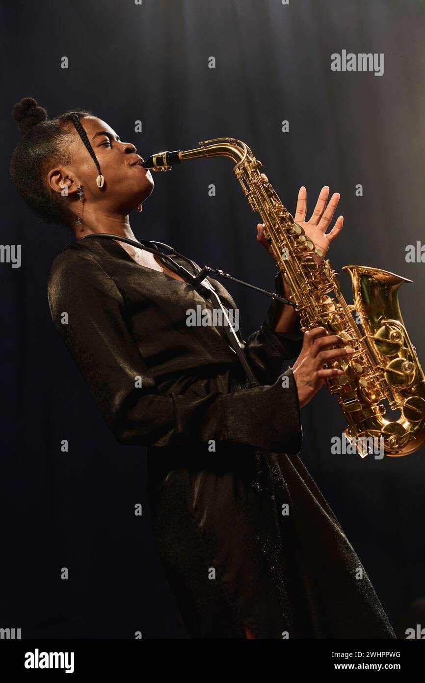 Side view portrait of passionate African American woman playing ...