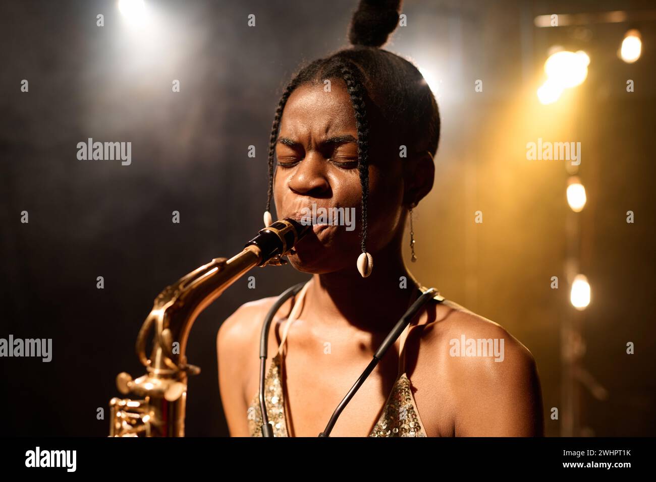 Portrait of classic mature musician playing acoustic guitar during ...