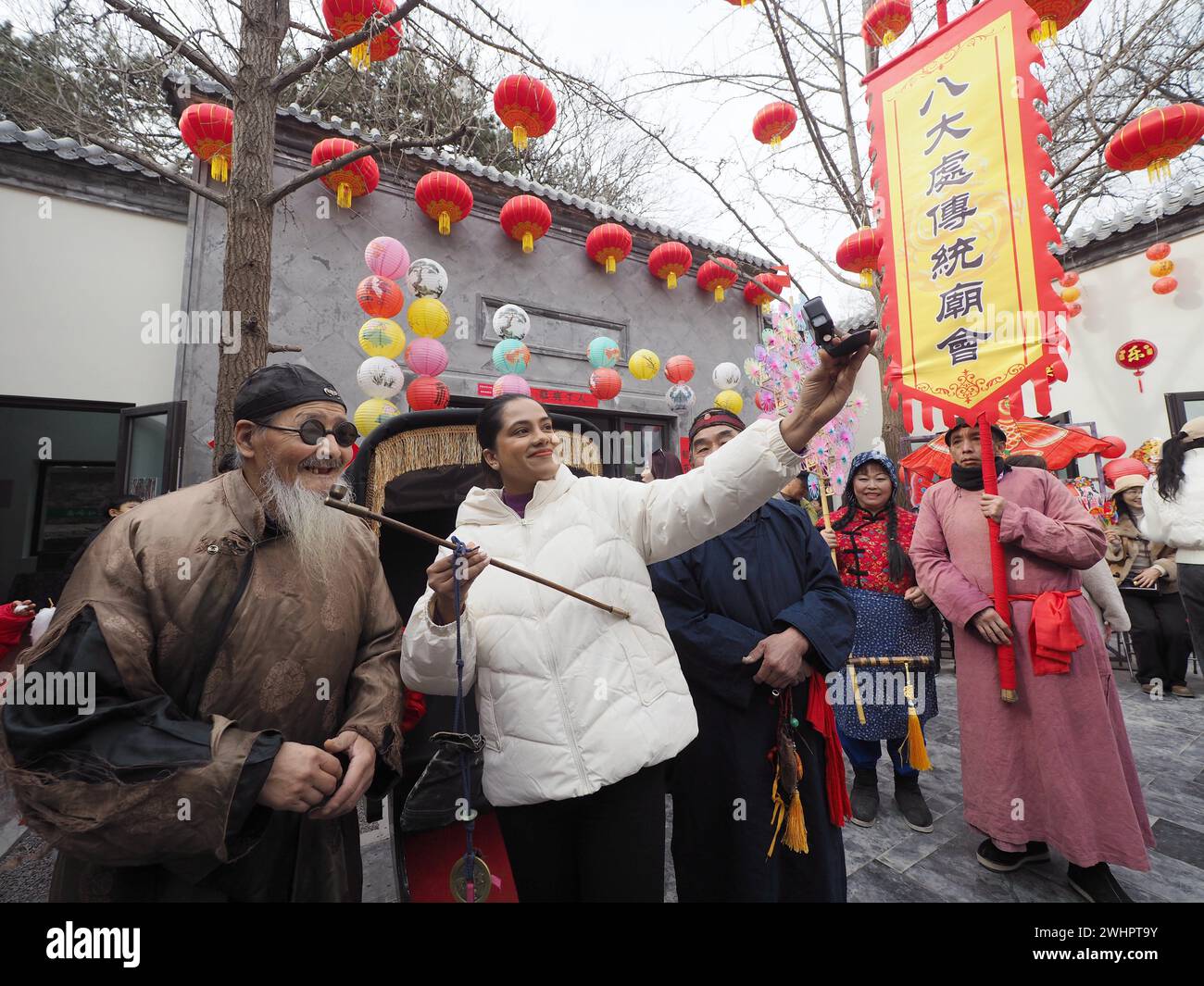 BEIJING, CHINA - FEBRUARY 11, 2024 - Foreign tourists pose for photos ...