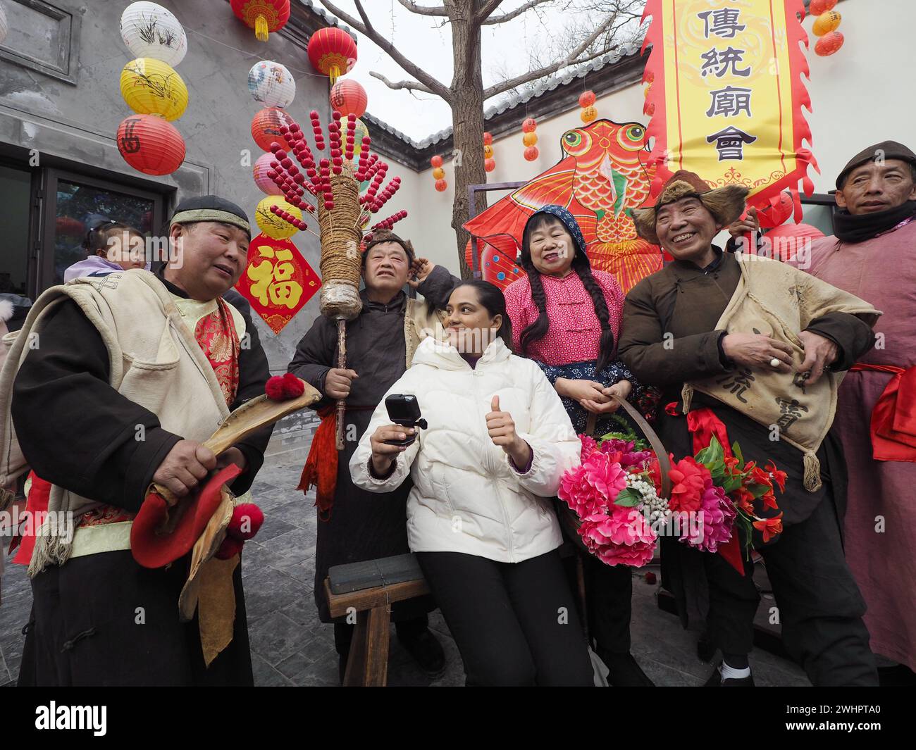 BEIJING, CHINA - FEBRUARY 11, 2024 - Foreign tourists pose for photos ...