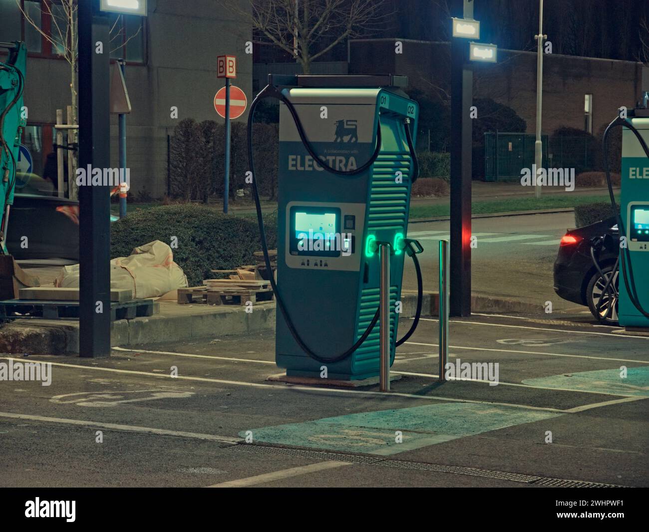 Brussels, Belgium. 6 February 2024. Street photography. Night city. Charging station Electra for ...