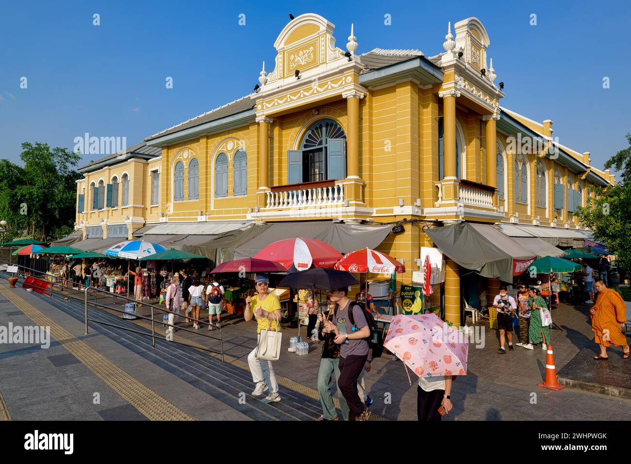 An ochre-colored building in traditional style at express boat pier Tha ...