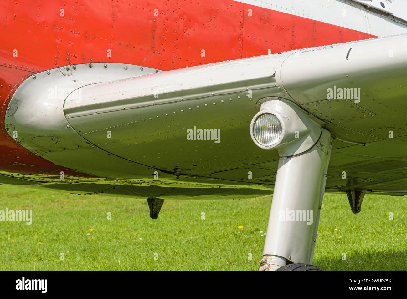 Airplane wing close up. rivet texture and lamp Stock Photo - Alamy