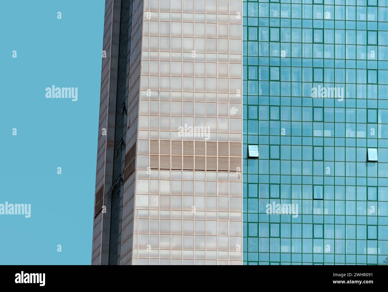 Many windows and walls facade of a modern skyscraper without people ...