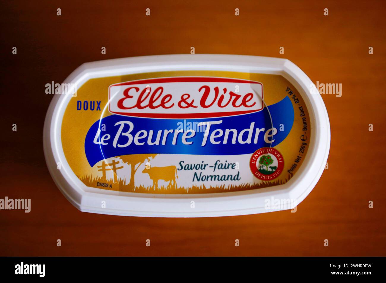 Pack of Elle & Vire butter on a wooden surface, showcasing the brand ...