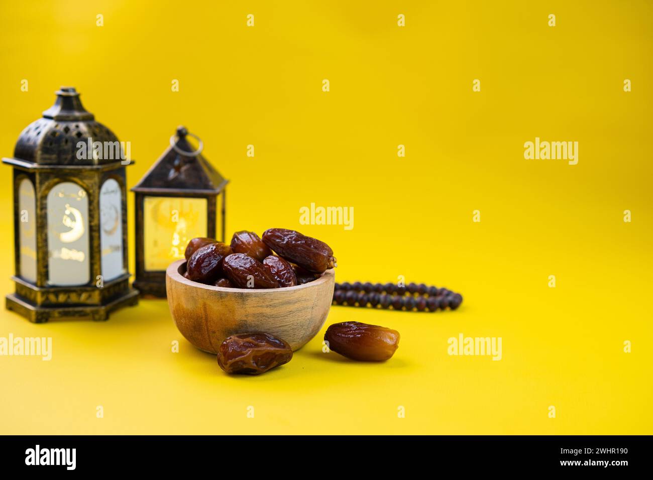 Dates fruit and Lantern decoration on yellow background. Islamic ...