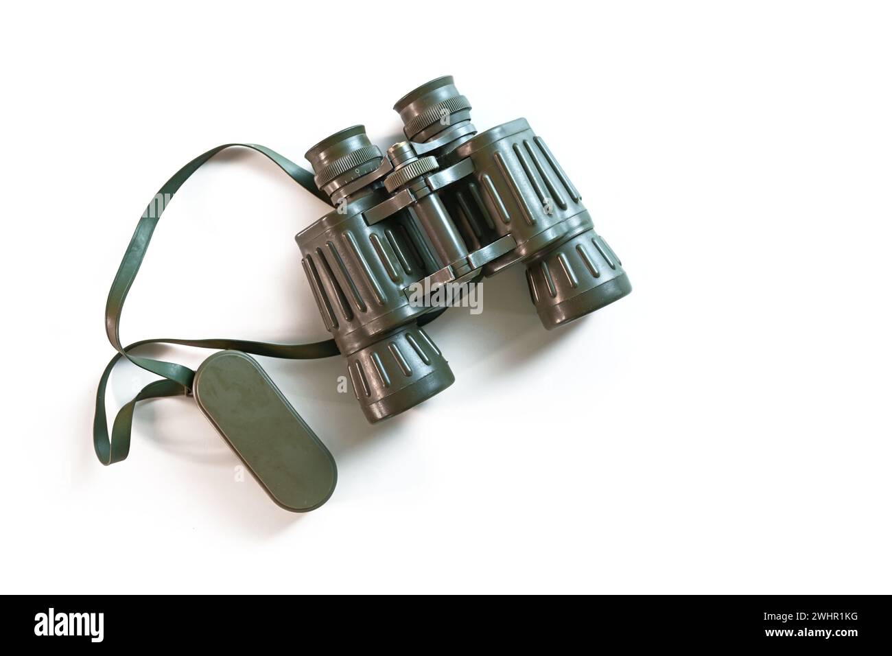 Used binoculars or field glasses with green rubber coating for ...