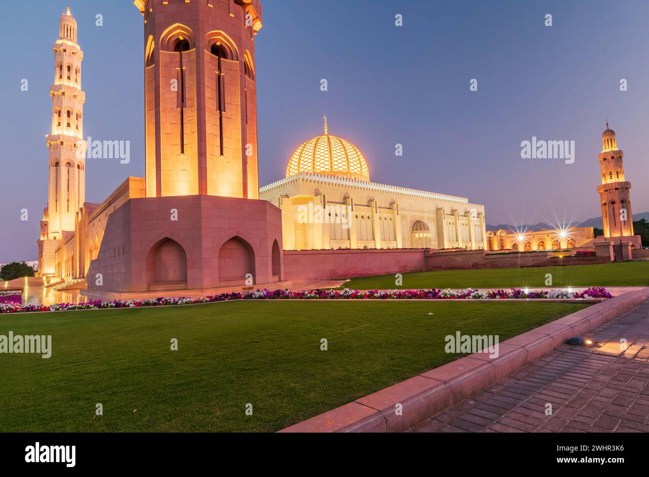 The Sultan Qaboos Grand Mosque illuminated view in blue hour, Muscat ...
