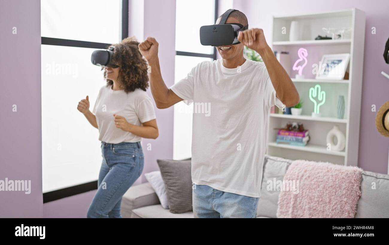Gaming glow, beautiful couple's love blooming in virtual reality dance ...