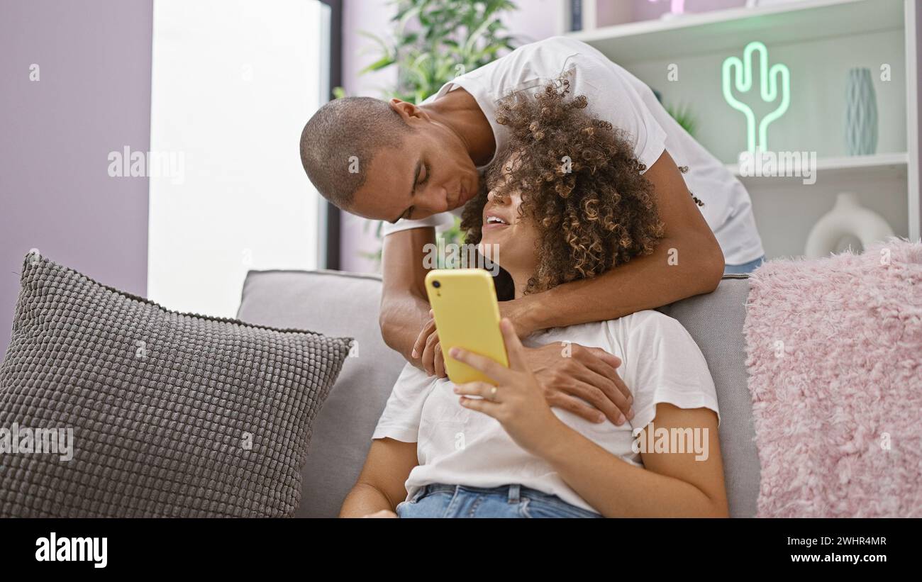 Beautiful couple confidently enjoying a fun-texting session, happily ...