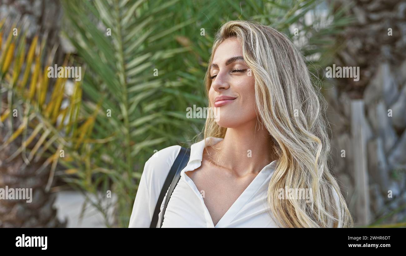 Beautiful young caucasian woman meditating, eyes closed, deeply ...