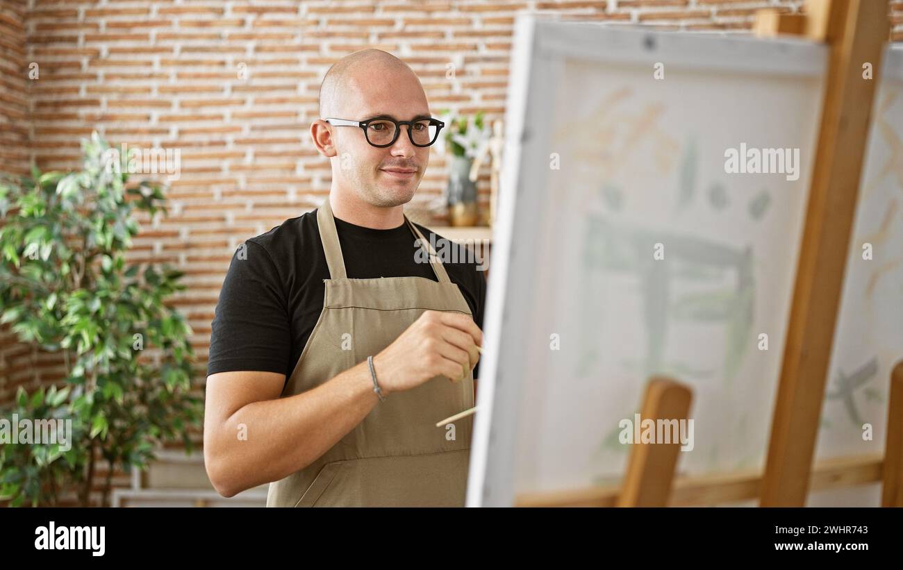 Young hispanic man artist smiling confident drawing at art studio Stock ...