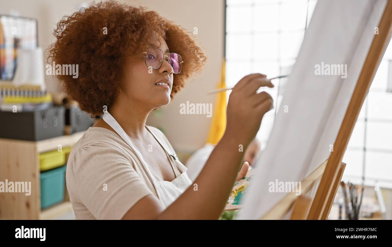 Two artists, partners in art and life, seriously engrossed in their ...