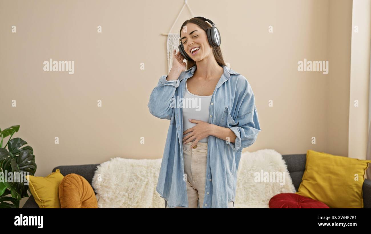 Breathtaking young hispanic woman swaying to the rhythm, dancing ...