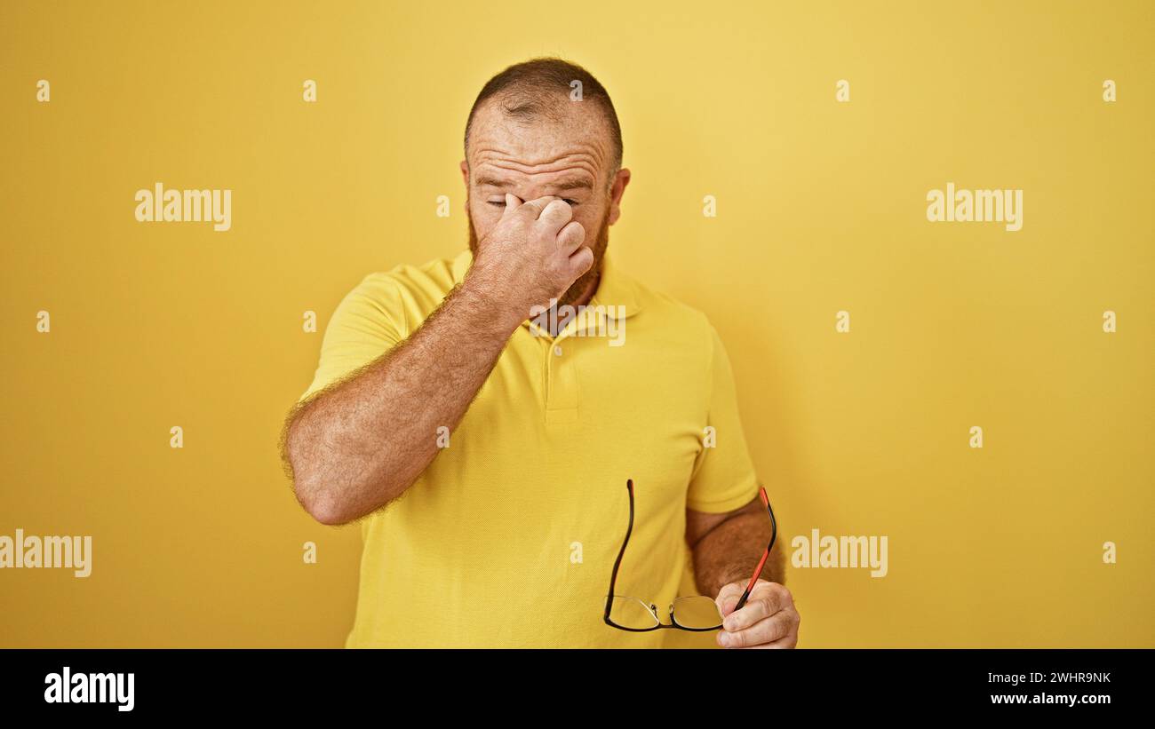Middle-aged male in crisis, stressed caucasian man takes off glasses ...