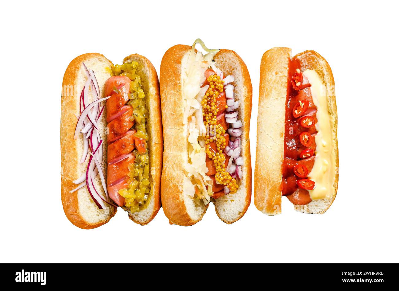 Hot dogs fully loaded with assorted toppings on a tray. Delicious hot ...