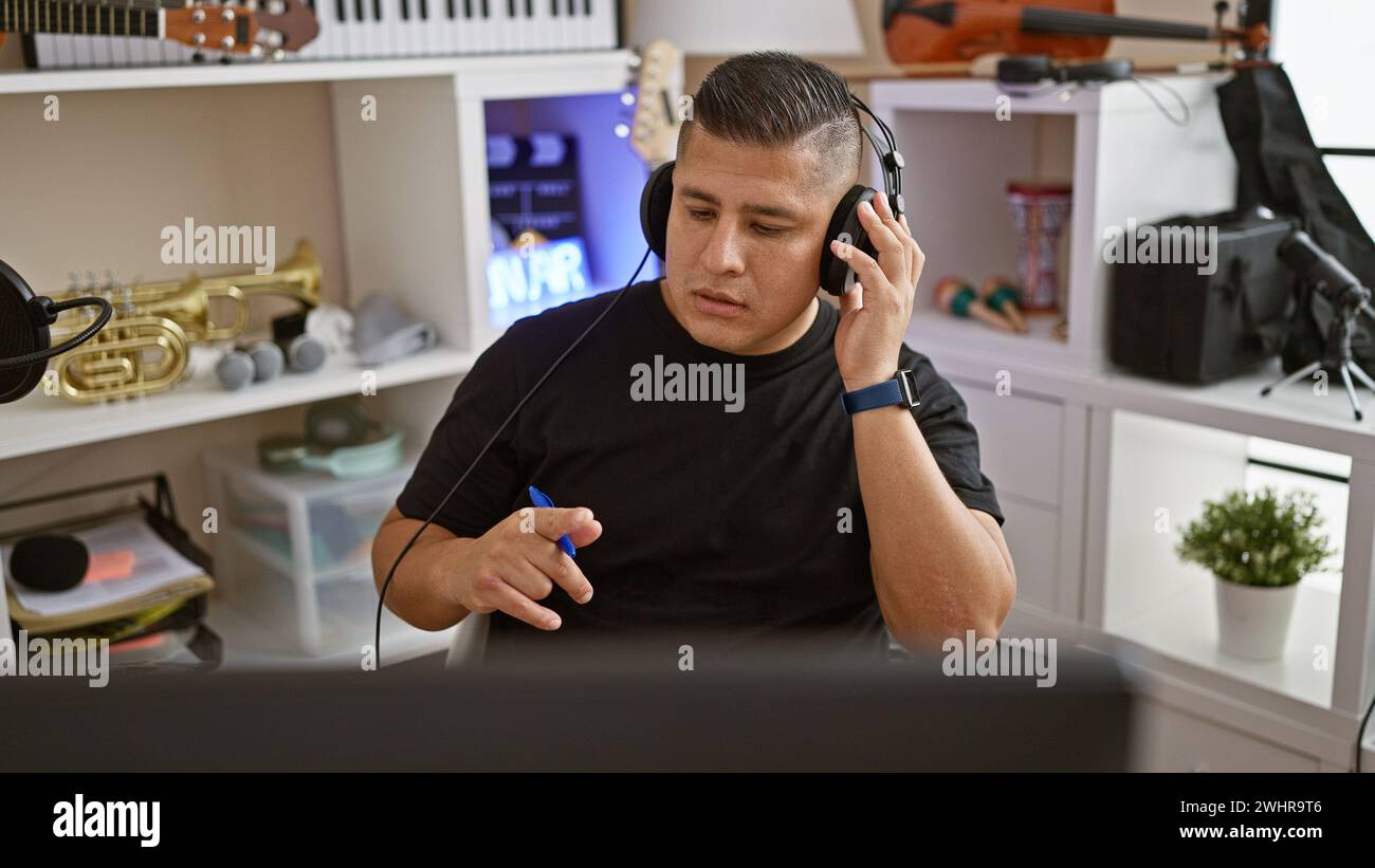 Passionate young latin musician man immersed in an energetic musical ...