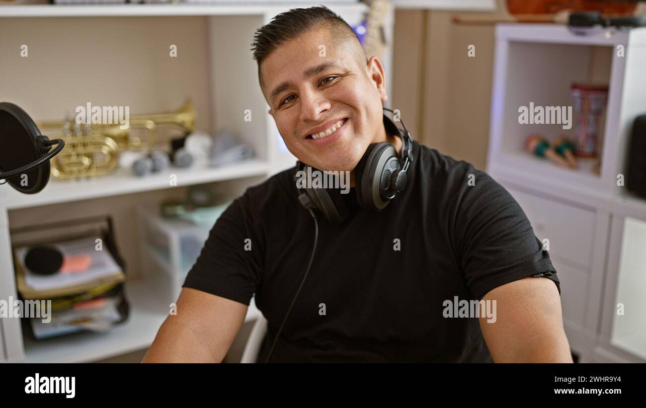 Radiating with confidence, young latin musician man, smiling and ...