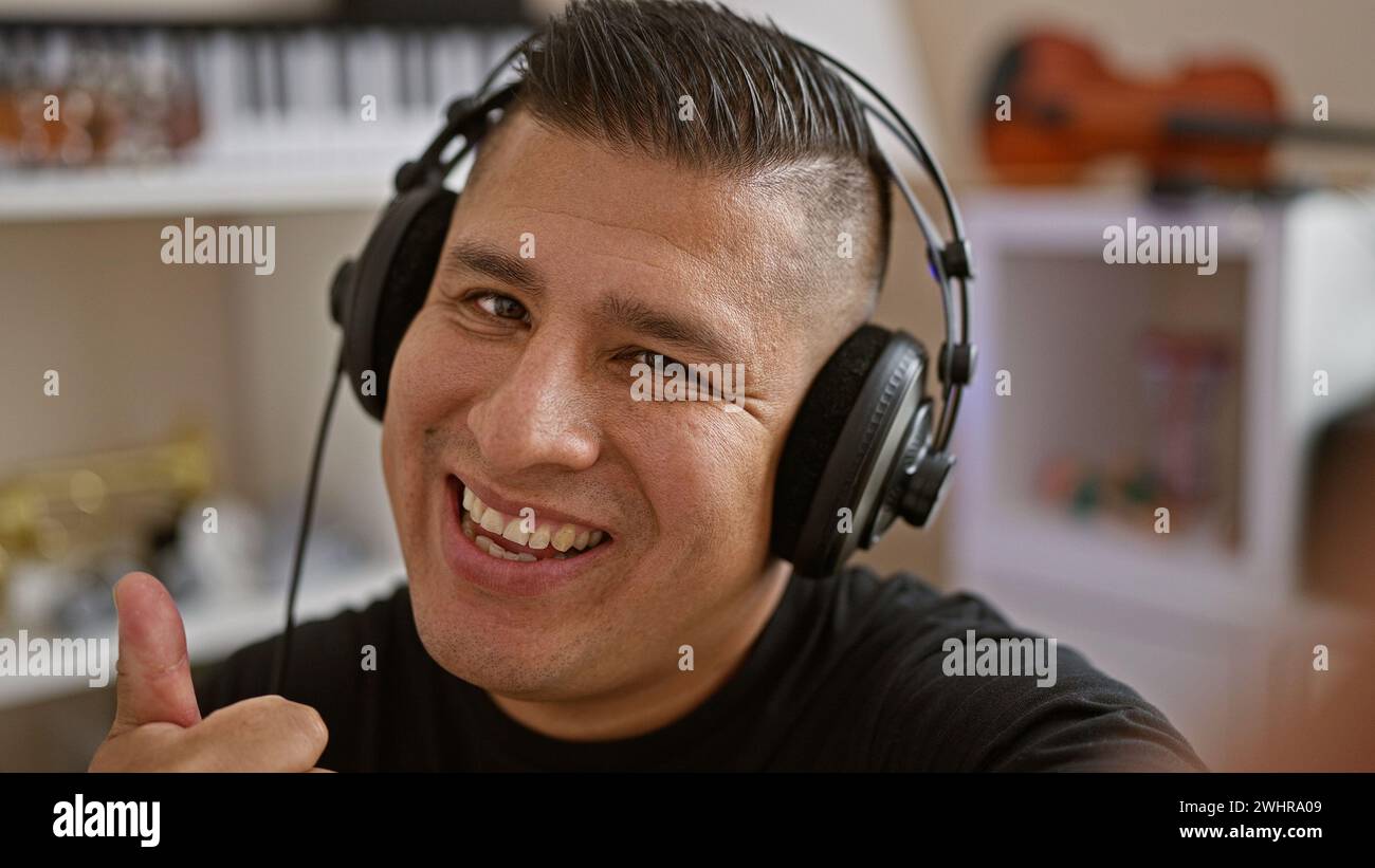 Handsome young hispanic guy, a professional musician, positively ...