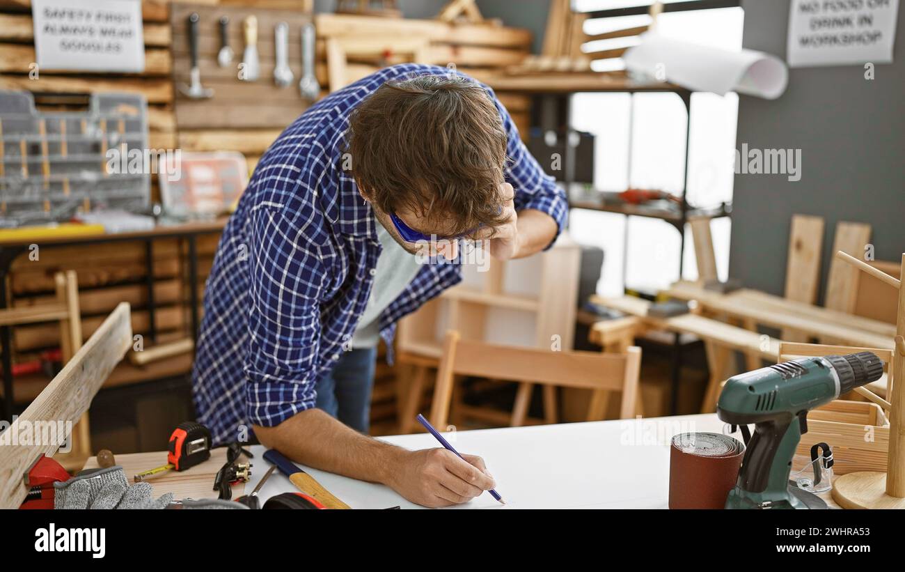 Handsome young hispanic man carpenter with blond beard, busy talking on ...