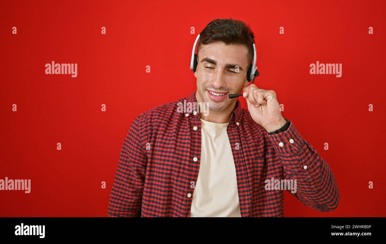 Dashing young hispanic man smiling wide, emanating confidence as a ...