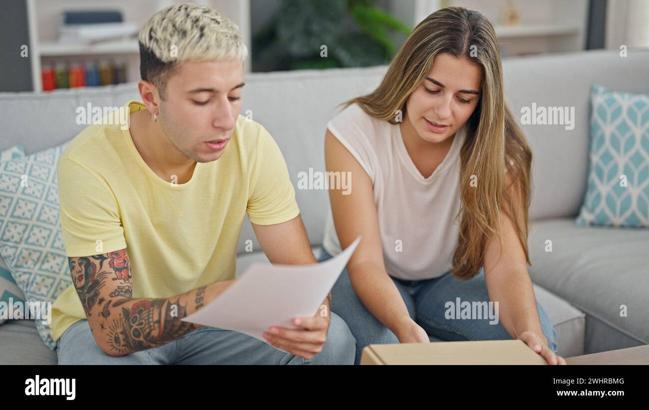 Beautiful couple reading paper unpacking hi-res stock photography and ...