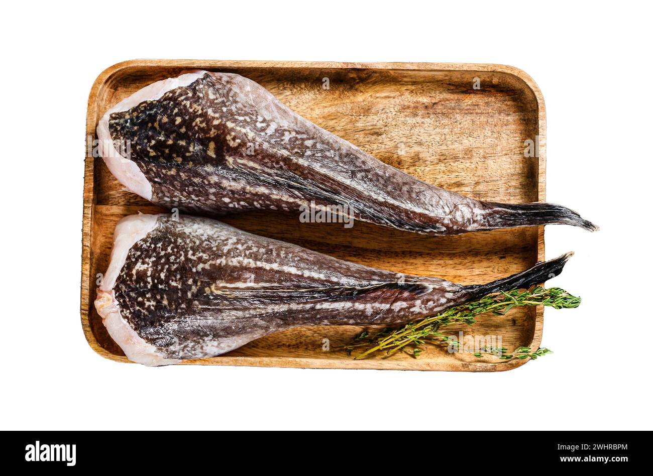 Fresh monkfish without a head on a wooden tray Isolated on white ...