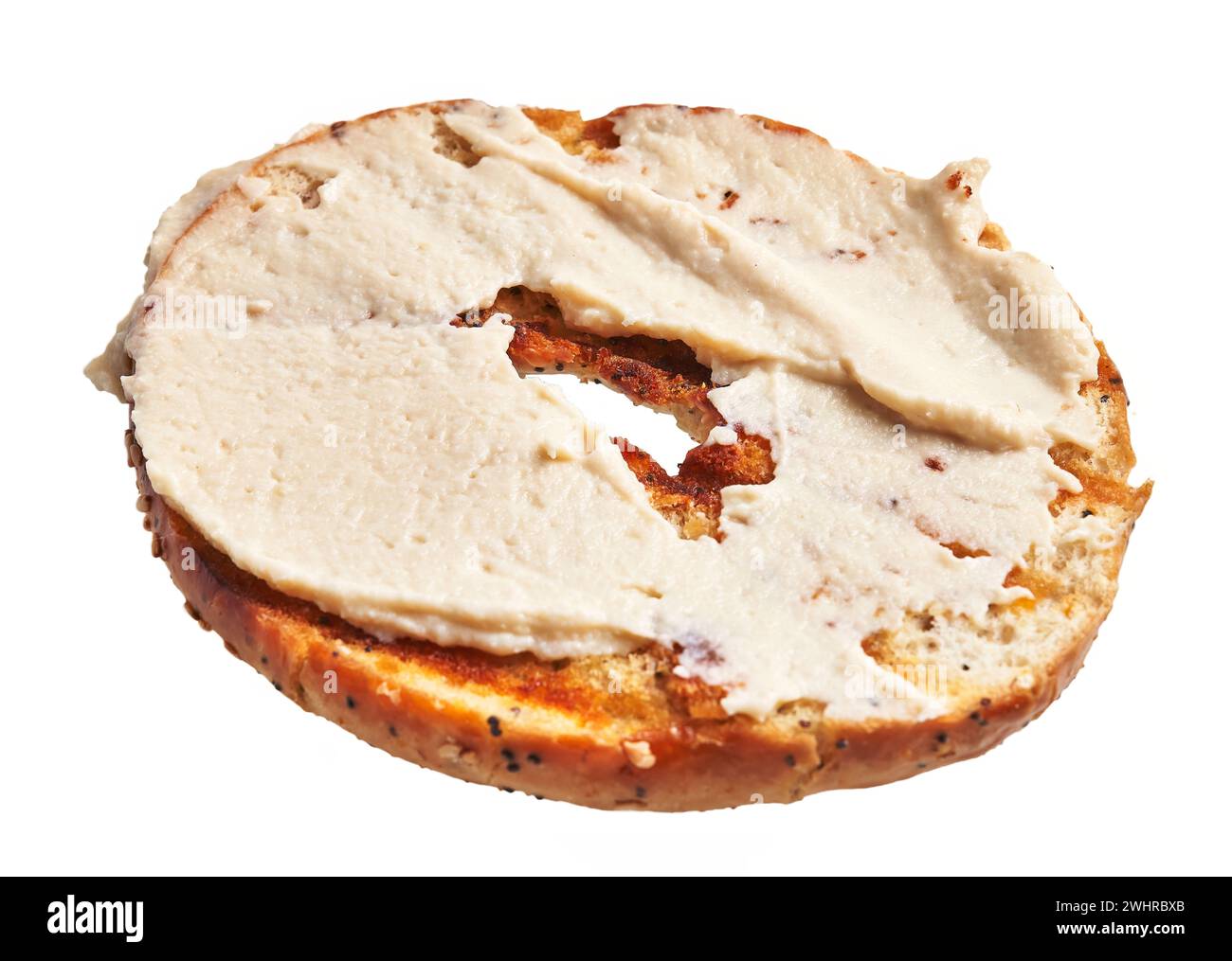A half-eaten bagel with cream cheese isolated on a white background ...