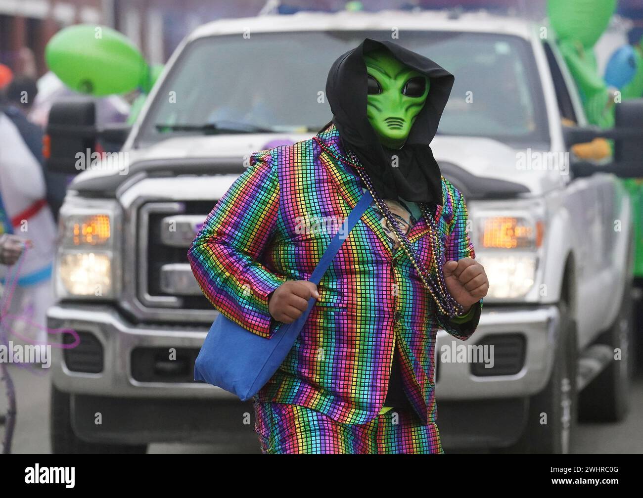 St. Louis, United States. 10th Feb, 2024. A parade participant dances ...