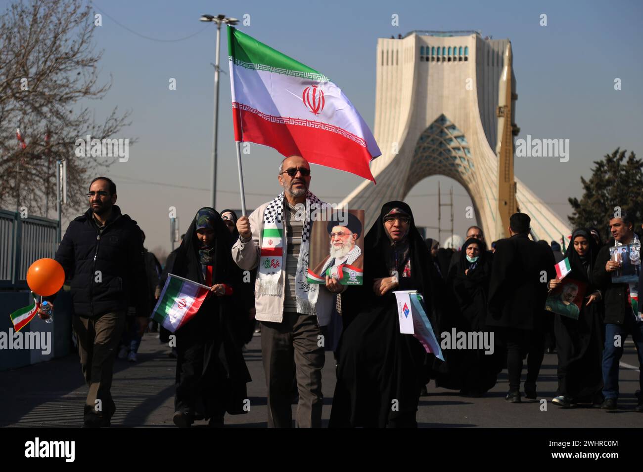 Tehran, Iran. 11th Feb, 2024. An Iranian Sejil (R) surface-to-surface missile is displayed at ...