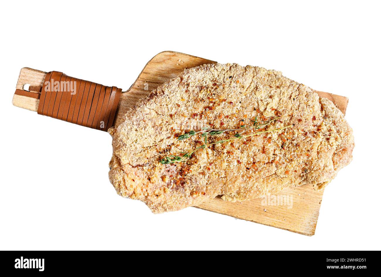 Raw chicken schnitzel in breadcrumbs. Isolated on white background. Top ...