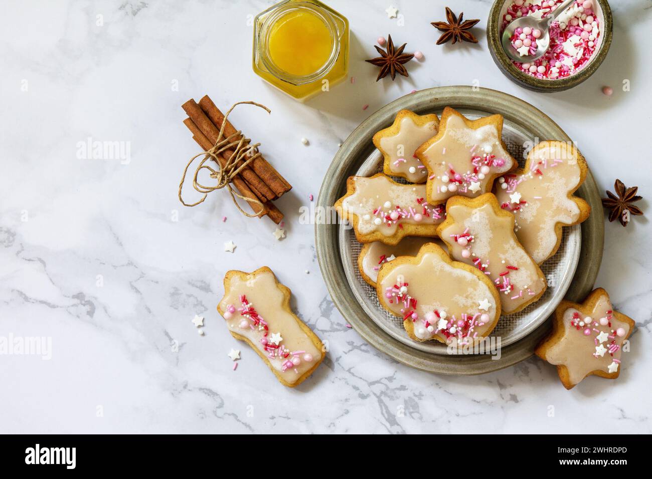 Homemade baking. Gingerbread cookies with glaze on a marble countertop ...